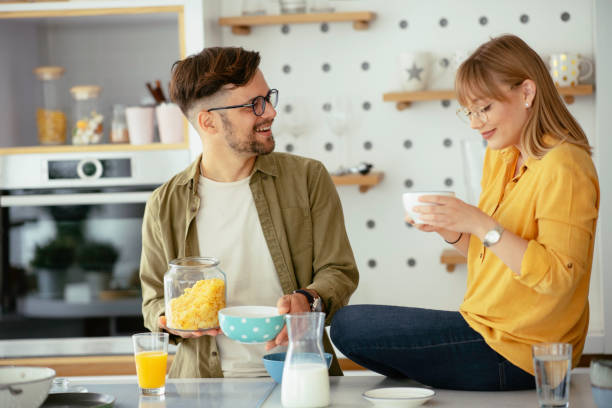 Free Stock Photo of Happy couple making breakfast together | Download ...