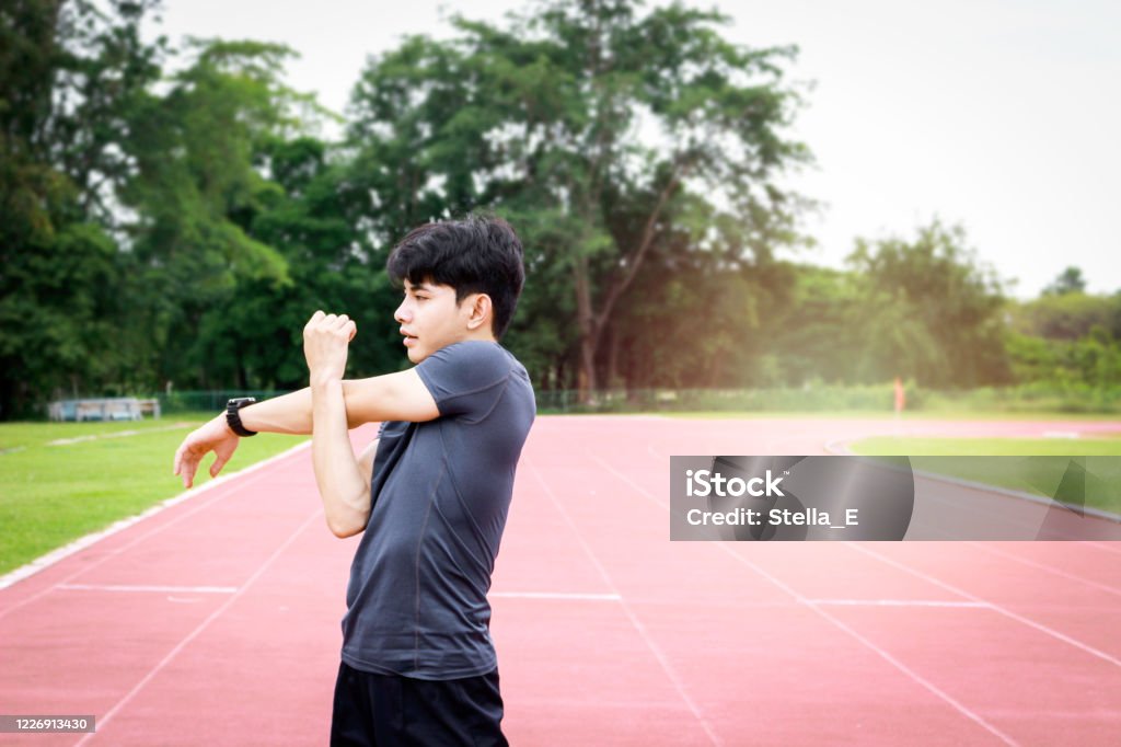 Young Runner Men Stretching Body Before Exercise Run Outdoor On