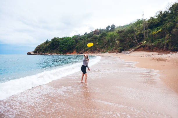 Free Stock Photo of Woman Playing Frisbee on Beach | Download Free ...