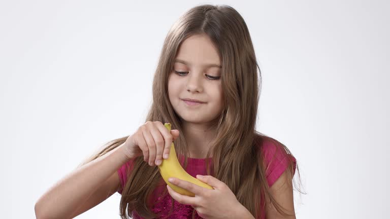 Girl Eating Banana