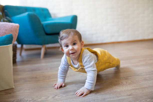 Free Stock Photo of Baby Crawling Over Wooden Table in Yellow Shirt ...