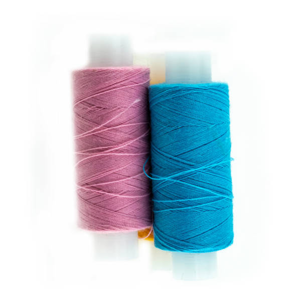 Free Stock Photo of Two Spools of Thread and a Spool of Thread on a ...