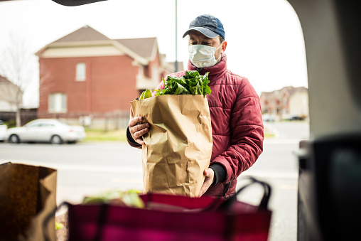 Mature Man Unloading Grocery From Car Trunk Stock Photo - Download ... Mature Man Unloading Grocery From Car Trunk Stock Photo - Download ...