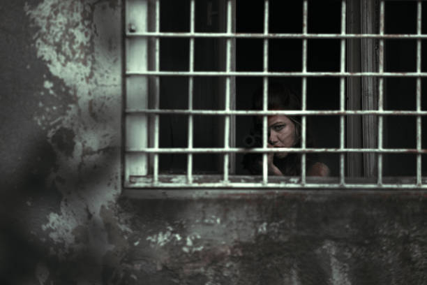 Free Stock Photo of Woman looking out through barred window | Download ...