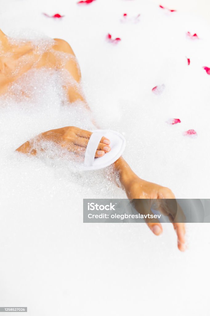Woman Washing Hands In Bath Tub With Foam Bubbles And Use Natural Jute