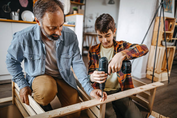 Free Stock Photo of A lovely son helps his father do carpentry at home ...