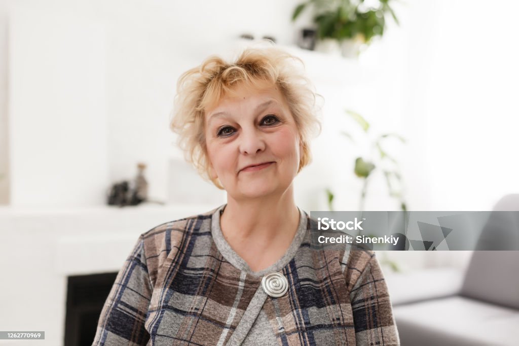 Smiling Middle Aged Mature Grey Haired Woman Looking At Camera Happy