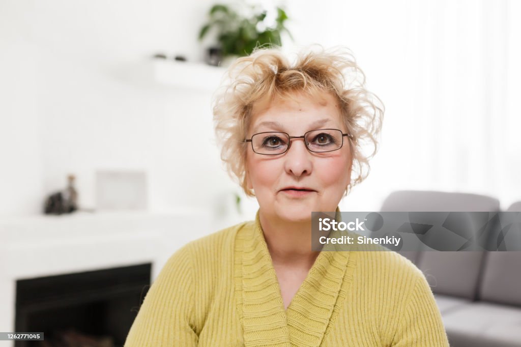 Smiling Middle Aged Mature Grey Haired Woman Looking At Camera Happy