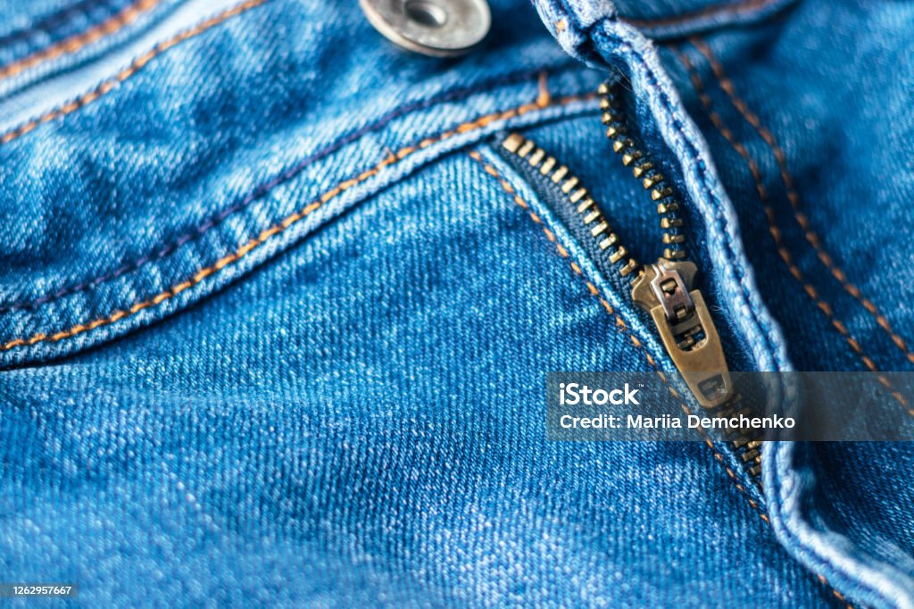 Jeans Front With Zipper Bright Blue Denim Fabric Texture Background Closeup View Selective Focus