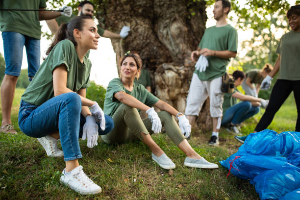 Free Stock Photo of A group of volunteers sitting on the grass ...