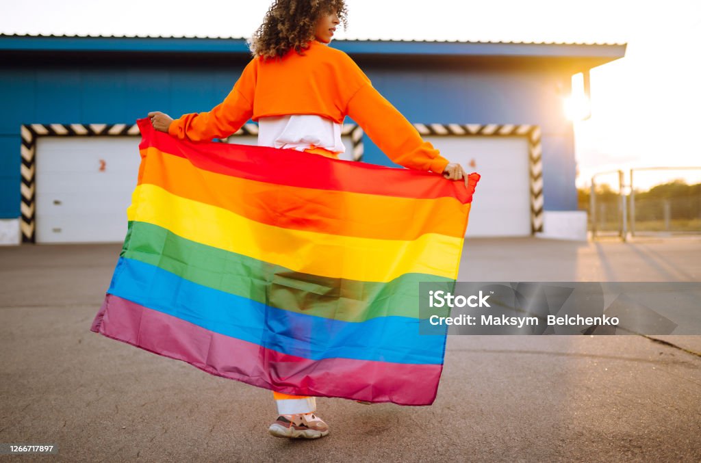 Beautiful African American Lesbian Woman With Lgbt Rainbow Flag At