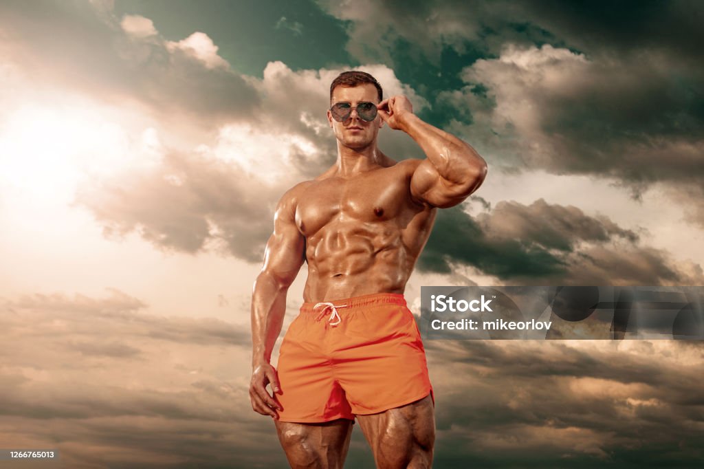 Fit Athlete Bodybuilder On The Beach Attractive Young Man Lifeguard