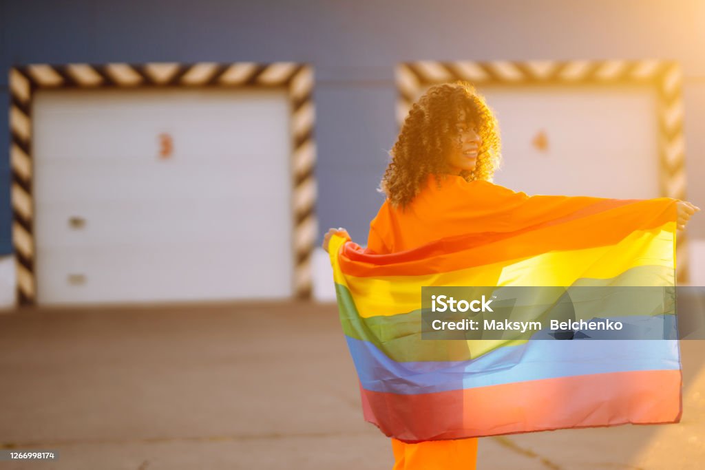 Beautiful African American Lesbian Woman With Lgbt Rainbow Flag At