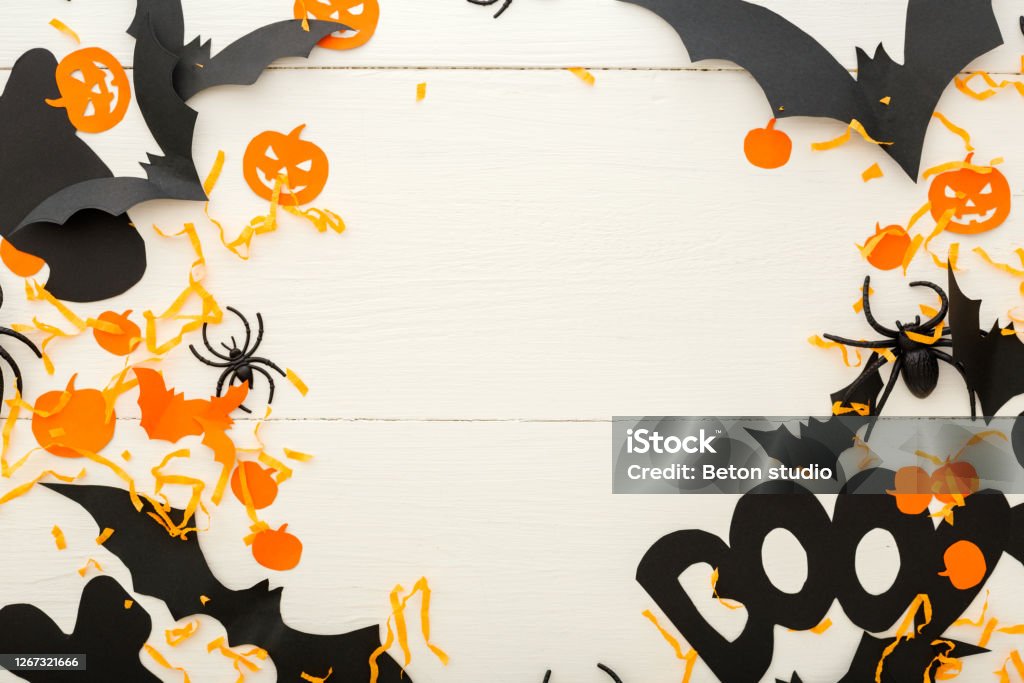 Halloween Background With Jackolanter Pumpkins Paper Bats Spiders Confetti On White Wooden