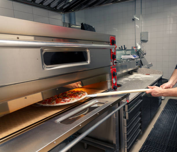 Free Stock Photo of Man Putting Something in the Oven | Download Free ...