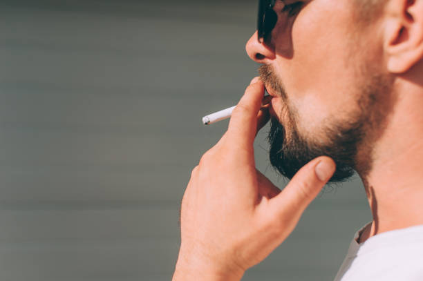 Free Stock Photo of Man Wearing Sunglasses and Smoking a Cigarette ...