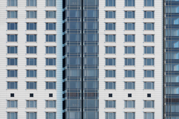 Free Stock Photo of Tall Building With Lots of Windows Surrounded by ...