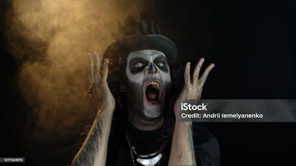 Creepy Man With Skeleton Makeup Guy Turning His Head And Looking At Camera Trying To Scare Stock