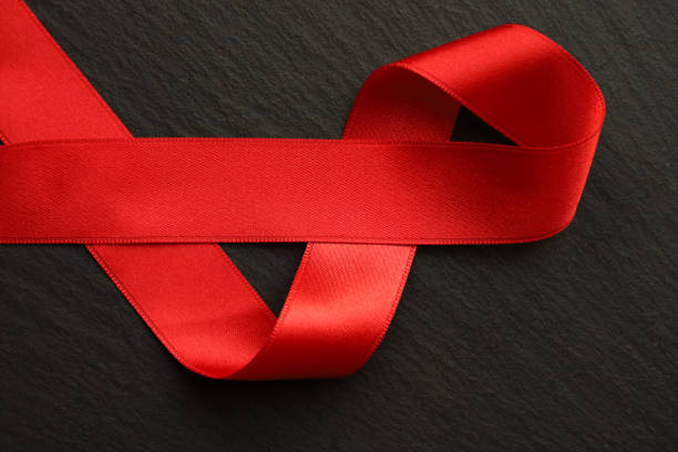 Free Stock Photo of Scissors Cutting Red Ribbon on Black Background ...