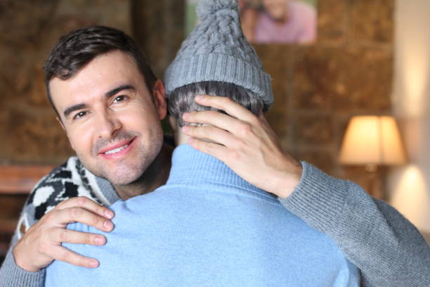 40 Mature Older Senior Gay Male Couple Smiling And Affectionate Stock