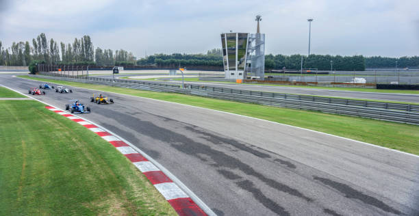 Free Stock Photo of Group of Motorcyclists Racing Around a Track ...