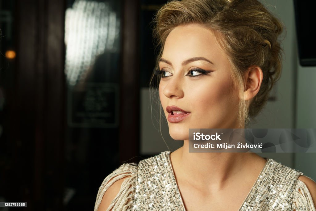 Close Up Portrait Of Beautiful Young Caucasian Blonde Woman Wearing