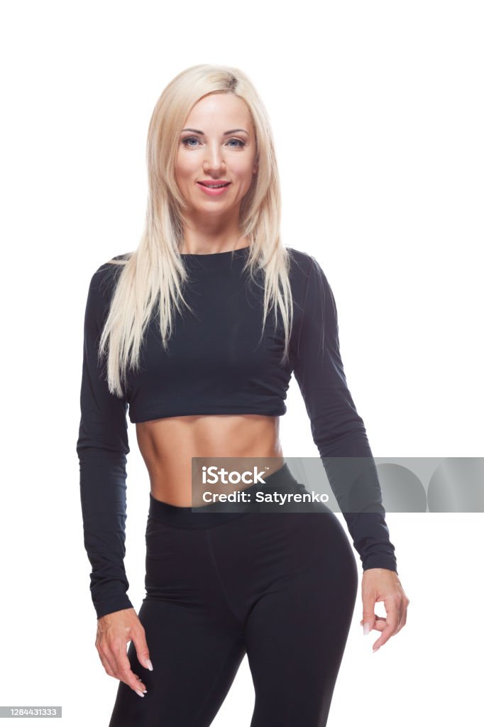 Blonde Fitness Woman Standing And Showing Off Her Toned And Muscular Athletic Body Isolated On