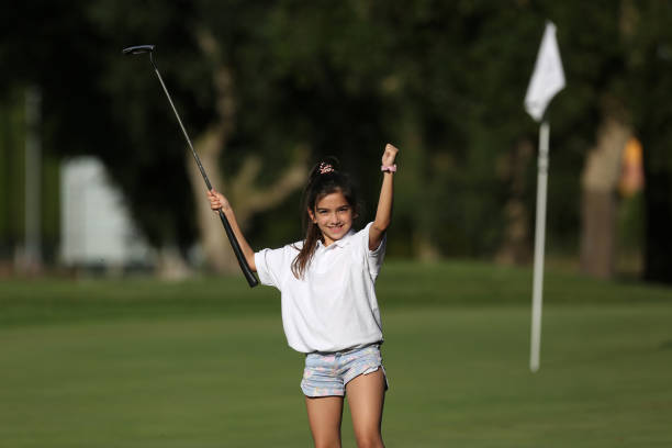Free Stock Photo of Young girl playing golf in green field, mid-swing ...