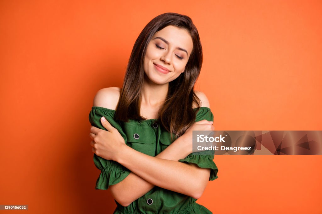 Photo Of Optimistic Sweet Woman Hug Herself Closed Eyes Wear Dark Shirt