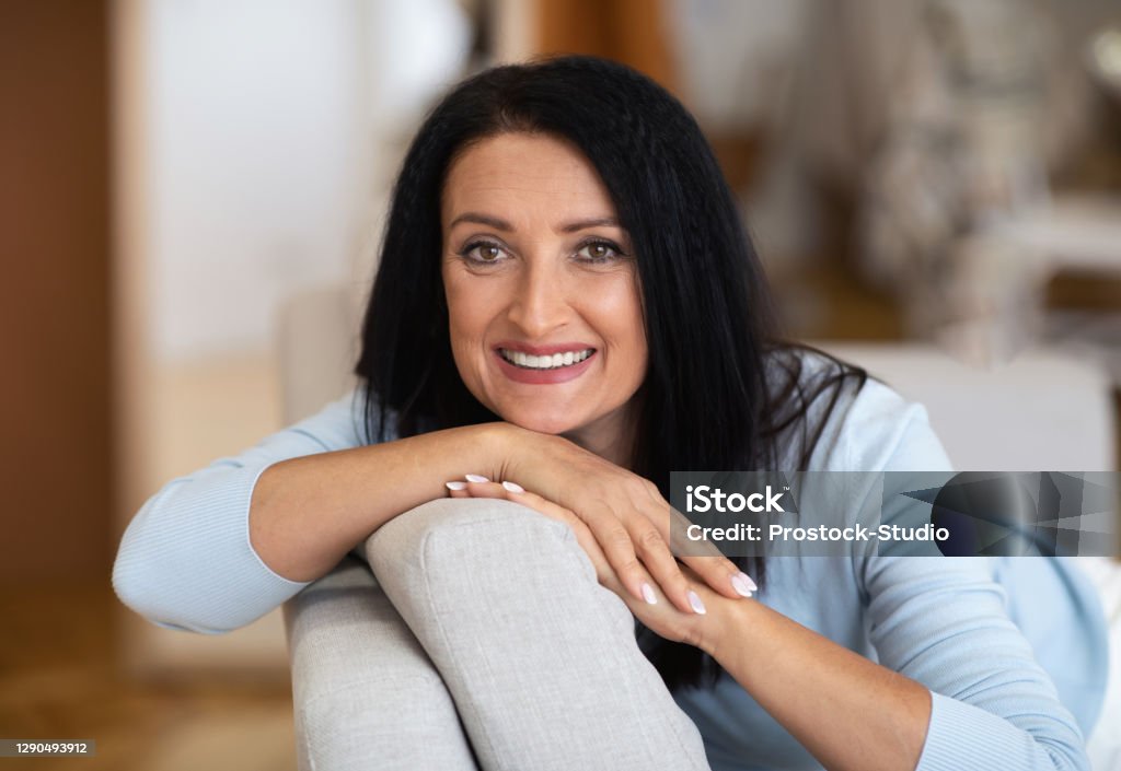Closeup Portrait Of Lovely Middleaged Brunette Woman Smiling Stock