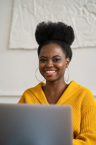 Cheerful African American Millennial Woman With Afro Hairstyle In