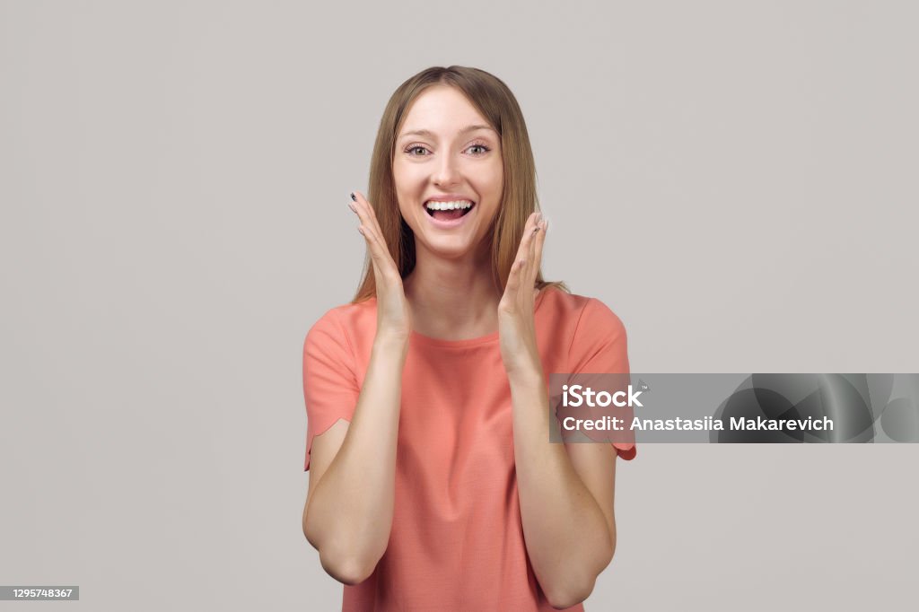 Surprised And Happy Blond Girl Express Overjoy And Surprised Smiling