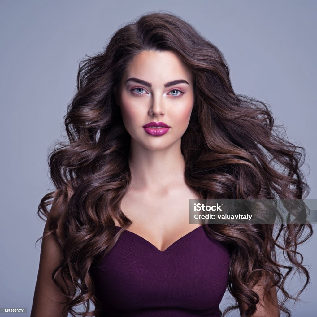 Face Of A Beautiful Woman With Long Brown Curly Hair Fashion Model With