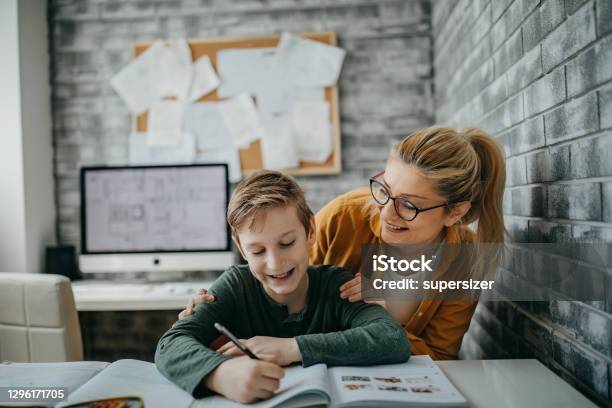 Mother Helps Her Son With Homework Stock Photo - Download Image Now ... Mother Helps Her Son With Homework Stock Photo - Download Image Now ...