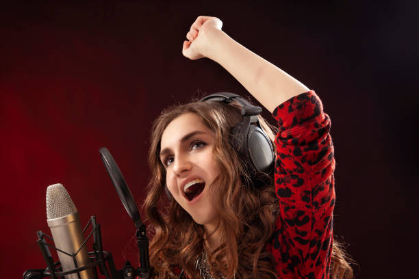 Free Stock Photo of Person holding a microphone on stage singing ...