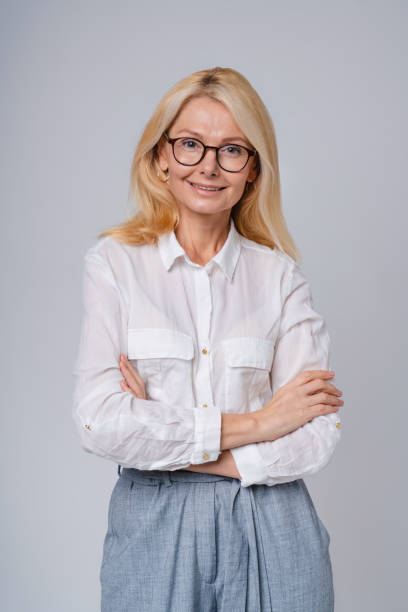 560 Portrait Of Smiling Business Woman With Folded Hands Isolated On