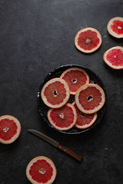 Free Stock Photo of Fresh cut grapefruit on a dark background ...