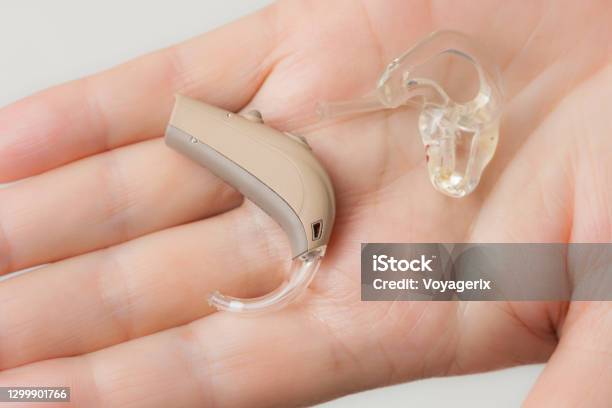 Senior Person Holding Hearing Aid Closeup Stock Photo - Download Image ... Senior Person Holding Hearing Aid Closeup Stock Photo - Download Image ...