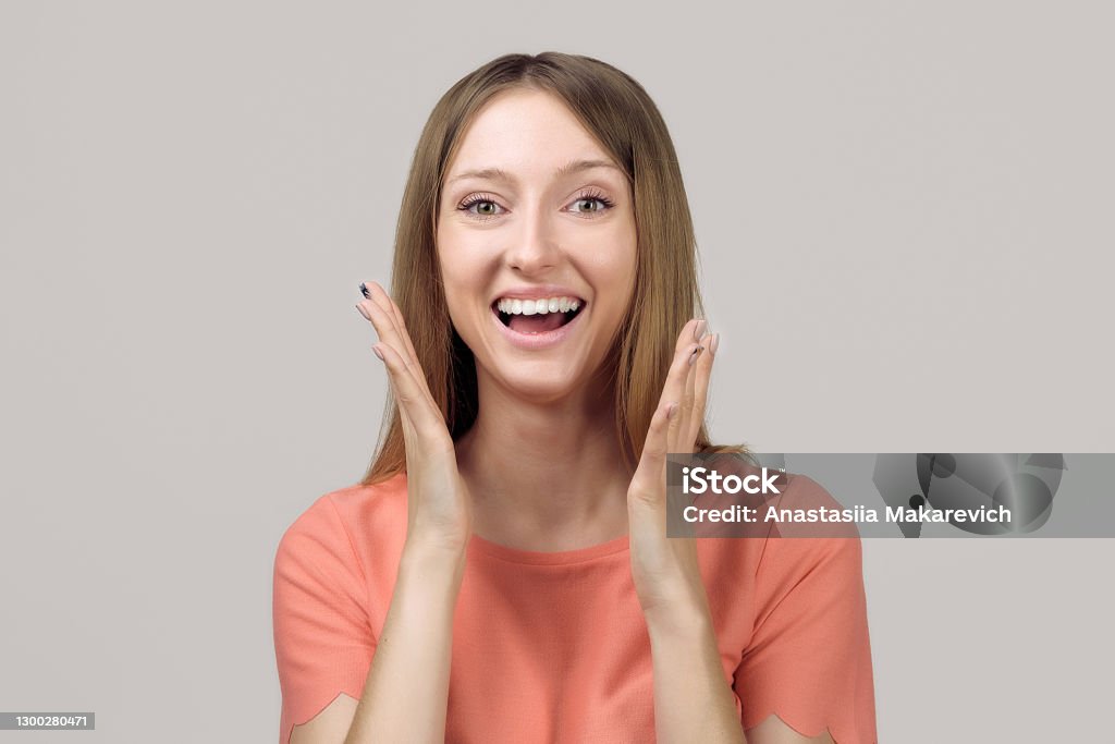 Surprised And Happy Blond Girl Express Overjoy And Surprised Smiling