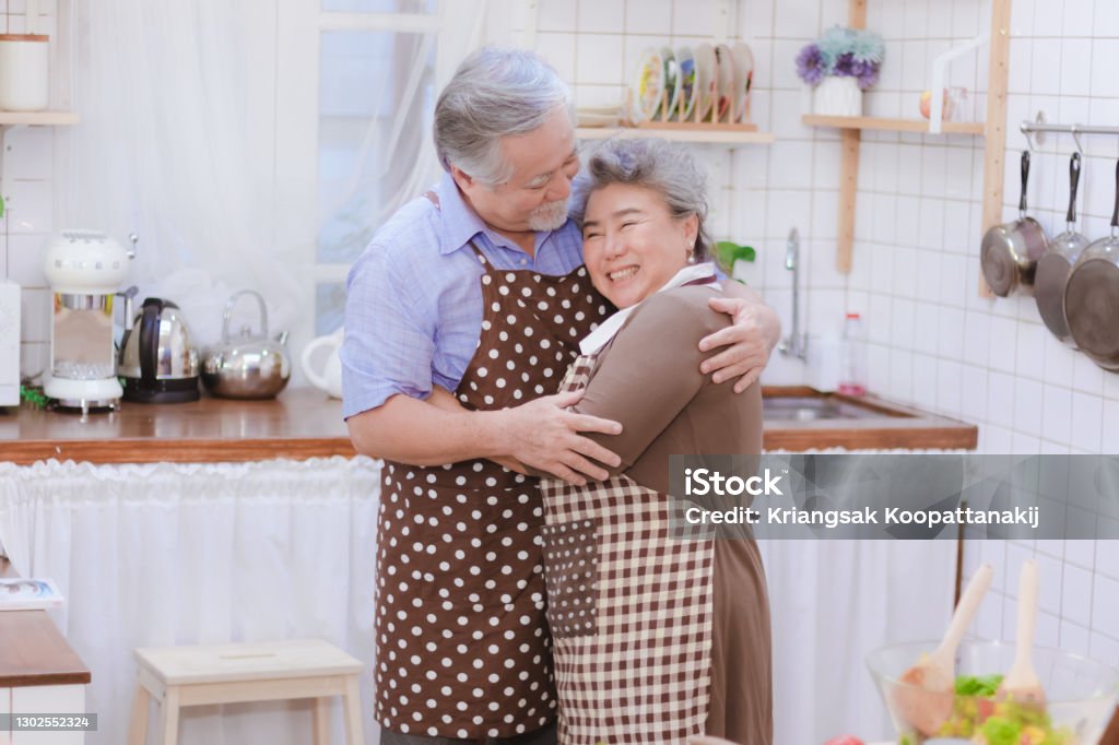 Asian Happy Retired Senior Smiling Cute Elderly Couple Hugging Holding