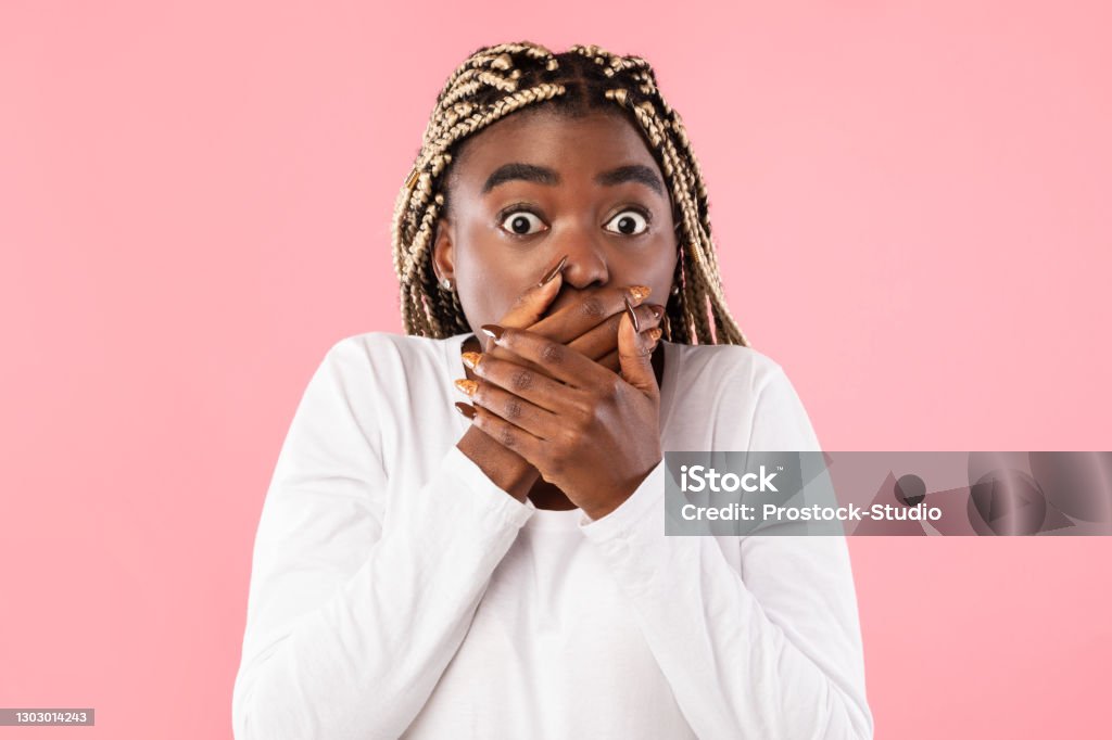 Surprised Young African American Woman Covering Her Mouth With Hands
