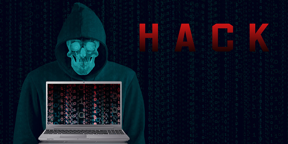 Hacker In Black Hood On Binary Background Code Containing A Binary Stream And A Security