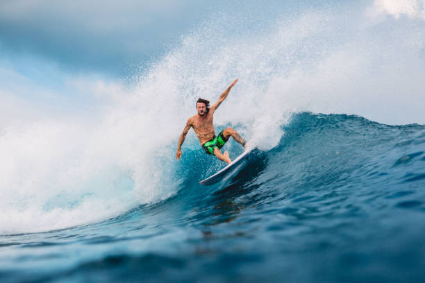 Free Stock Photo of Man Riding Surfboard on Wave in Ocean | Download ...