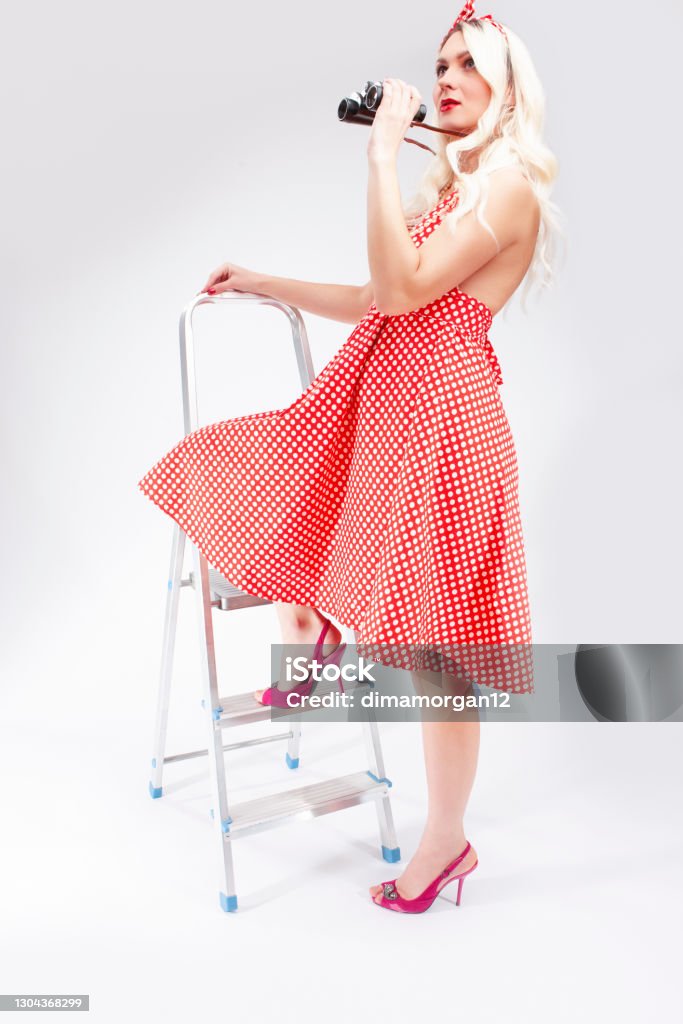 Full Length Portrait Of Dreaming Caucasian Blond Girl Pinup Style Posing With Binoculars Near