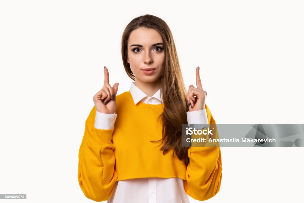 Portrait Of Attractive Girl Pointing Fingers Up Showing Good Shopping