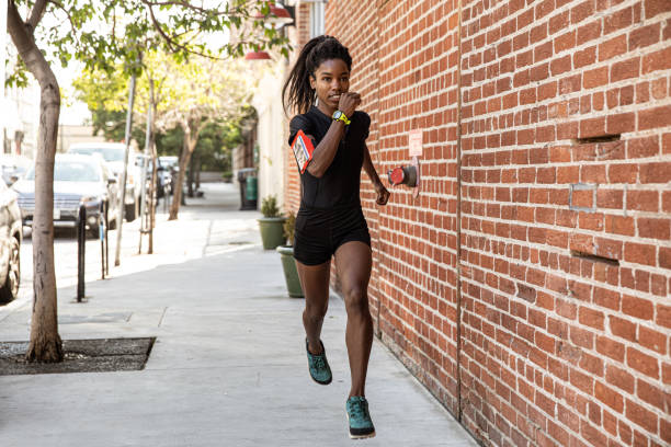 Free Stock Photo of Black woman, afro hairstyle, running outdoors in ...