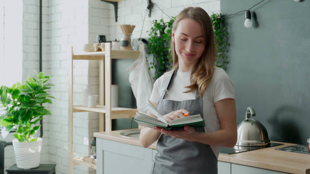Free Stock Photo of Woman Reading a Book in a Kitchen | Download Free ...