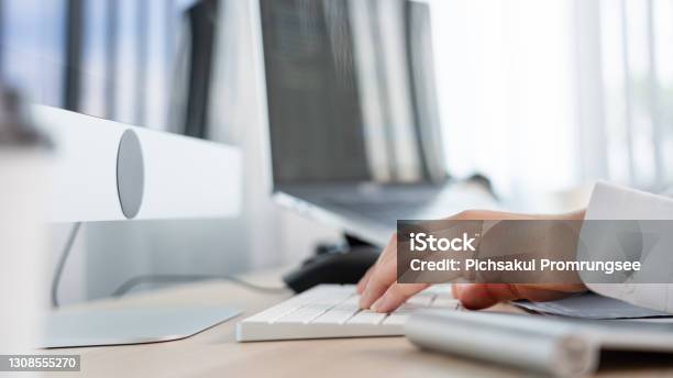 Young Asian Woman Programmer Typing Code Working With Computer At Table Coding Cyberspace And