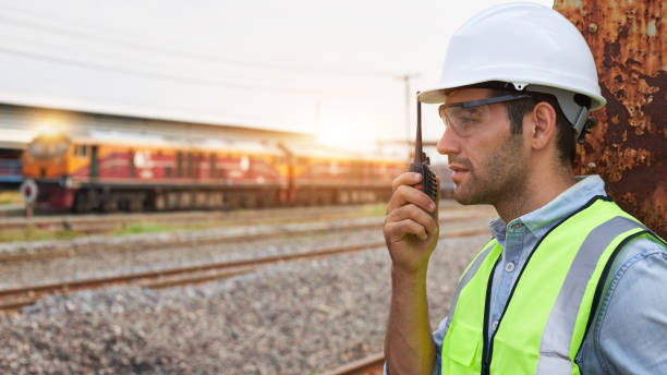 Free Stock Photo of Railway engineer holding a walkie-talkie on the ...