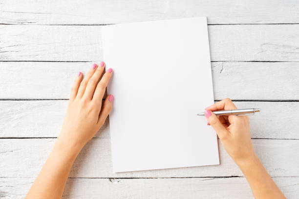 Free Stock Photo of Overhead view of a hand drawing on white sheet of ...
